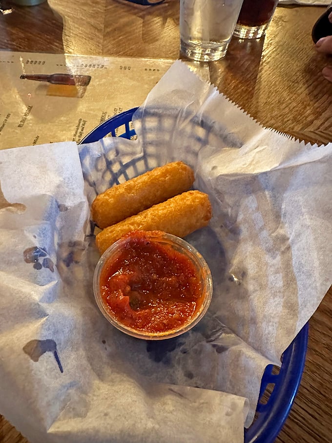 Golden-fried mozzarella sticks with marinara sauce &ndash; proof that sometimes the simplest pleasures are the most satisfying, especially when done right.