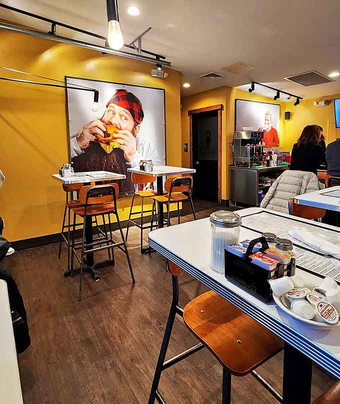 Yellow walls and wood accents create a sunshine effect even on cloudy days, while photographs of happy eaters remind you you're part of a delicious tradition.