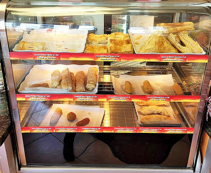 A glass case of temptation where resistance is futile &ndash; each shelf offering golden, flaky reasons to abandon all dietary restraint.
