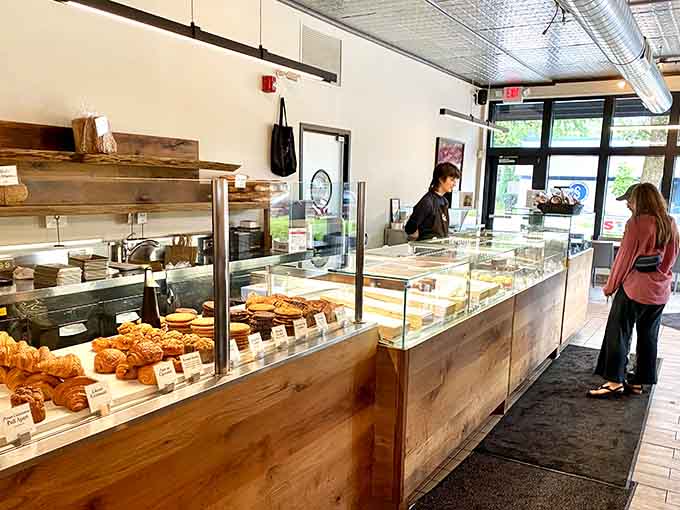 The pastry counter gleams with possibilities, where every selection promises to deliver that perfect bite you've been craving all morning.
