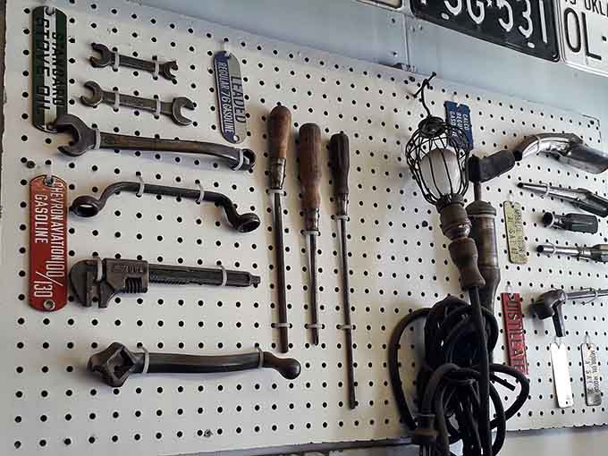Vintage tools hanging on pegboard walls look like industrial art installations, each wrench and screwdriver built to last generations rather than a single project.