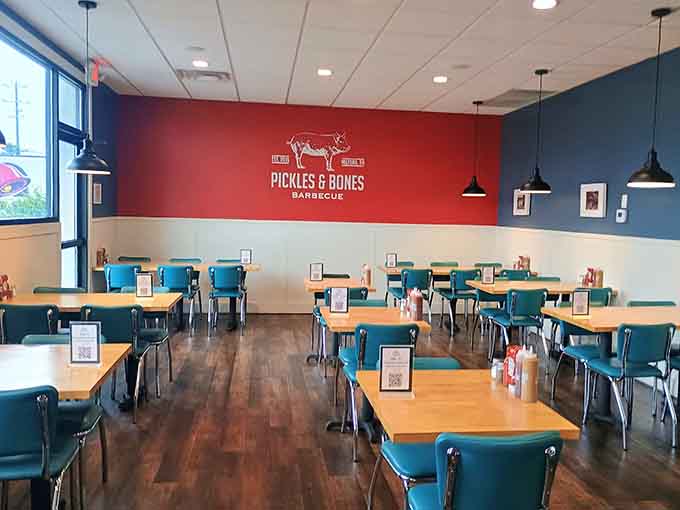 Spacious dining area with cheerful blue chairs and plenty of room to spread out and enjoy your barbecue feast.