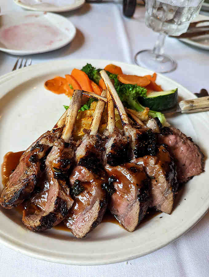 The rack of lamb stands at attention, each bone precisely frenched and the meat cooked to that perfect blush pink that lamb lovers dream about.