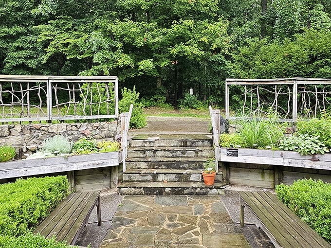 Stone steps and rustic railings lead visitors to new garden rooms waiting to be discovered.