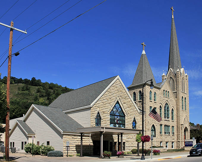 Rushford Lutheran Church's impressive stone architecture reaches skyward, anchoring the community in both faith and history.