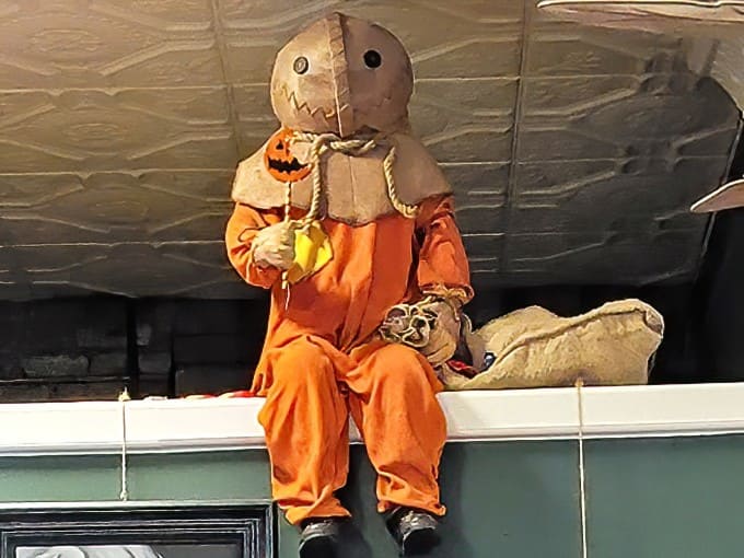 This cheerful character adds a touch of whimsy to the proceedings, proving that spooky and fun aren't mutually exclusive concepts.