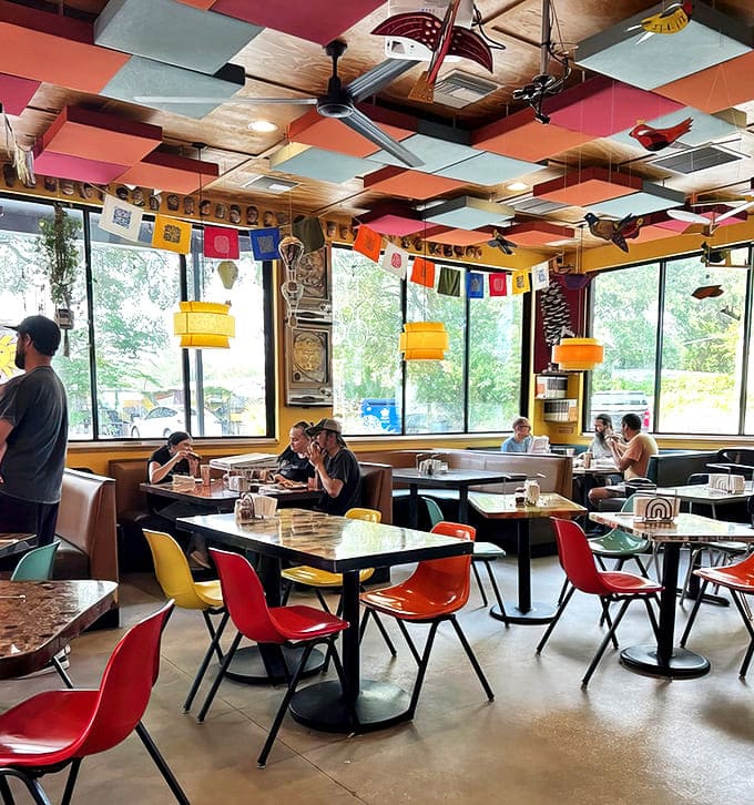 Multicolored chairs brighten the seating area, where every table offers a different perspective on this kaleidoscope of culinary creativity.