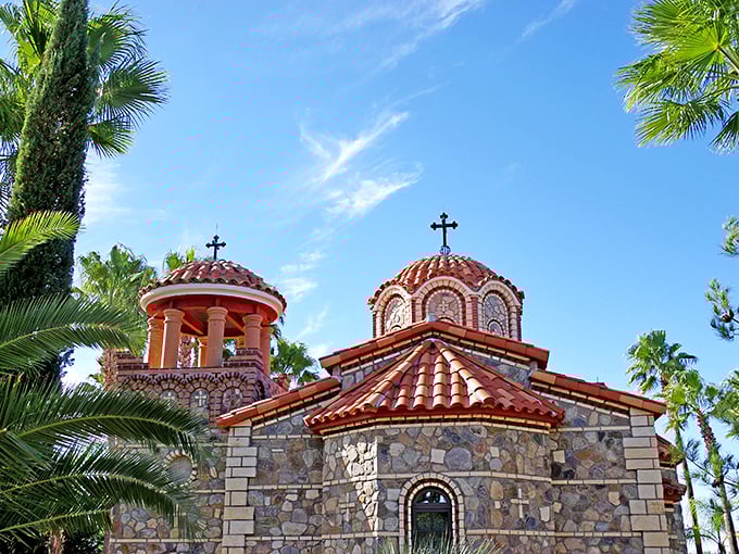St. Anthony's Greek Orthodox Monastery's red-domed chapels create a Mediterranean mirage among the cacti, a spiritual haven where desert meets devotion.