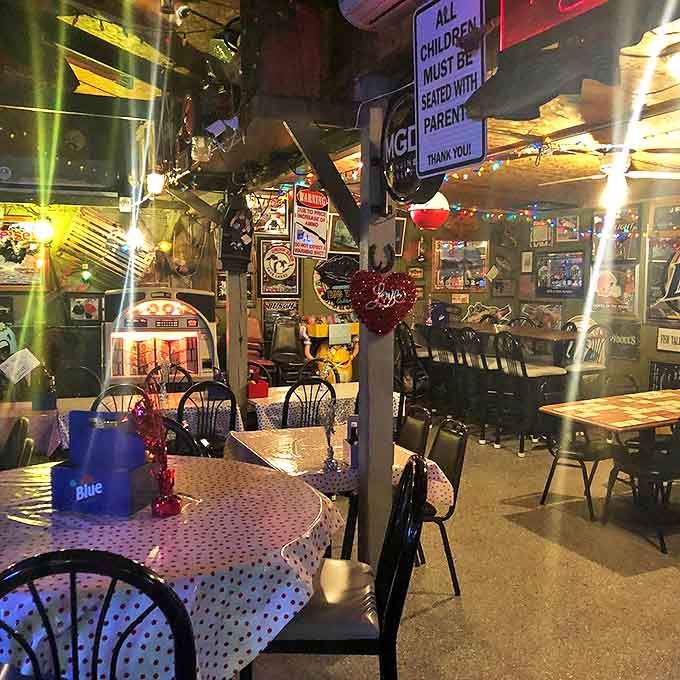Evening dining at Tackle Box 2 transforms the cluttered space into a cozy wonderland, where every twinkling light highlights another treasure.