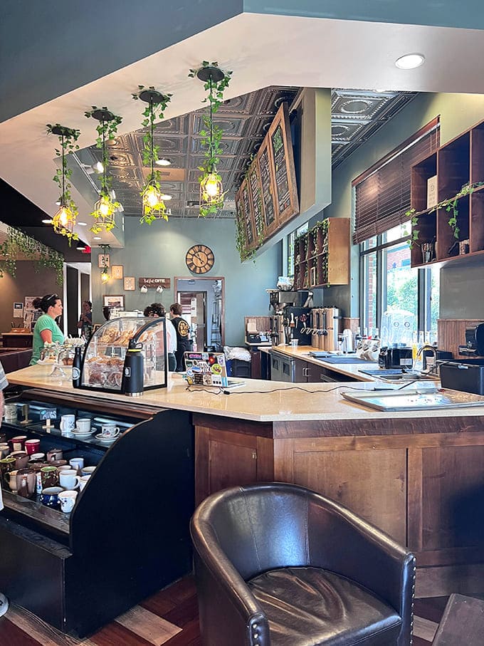 Behind the counter, the organized chaos of a working coffee shop reveals the machinery and menu boards that make magic happen.