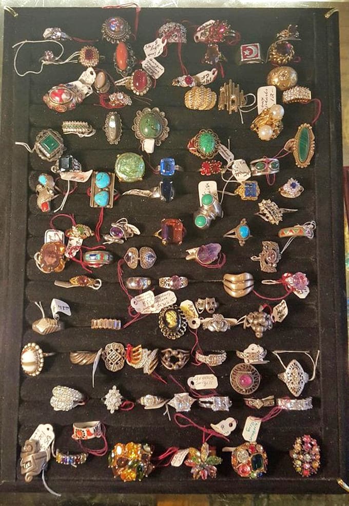 A treasure trove of vintage rings representing decades of style, each one once adorning someone's hand during their own important moments.