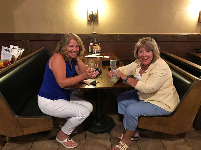 These happy diners know they've found something special, raising their glasses to good food and even better company tonight.