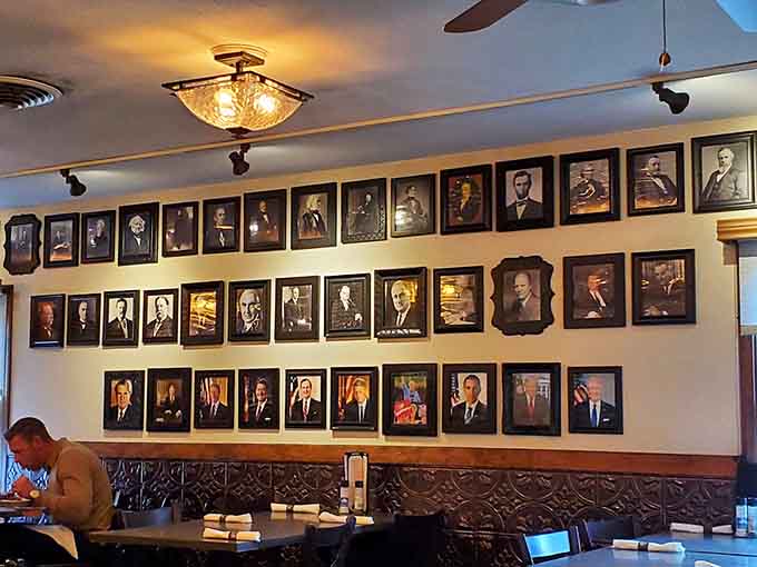 Walls decorated with vintage portraits create a dining room that feels like eating dinner in Ohio's most interesting history book.