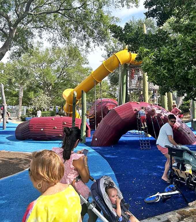 Where strangers become playground friends and parents exchange that universal look that says, "Yes, mine also refuses to leave."