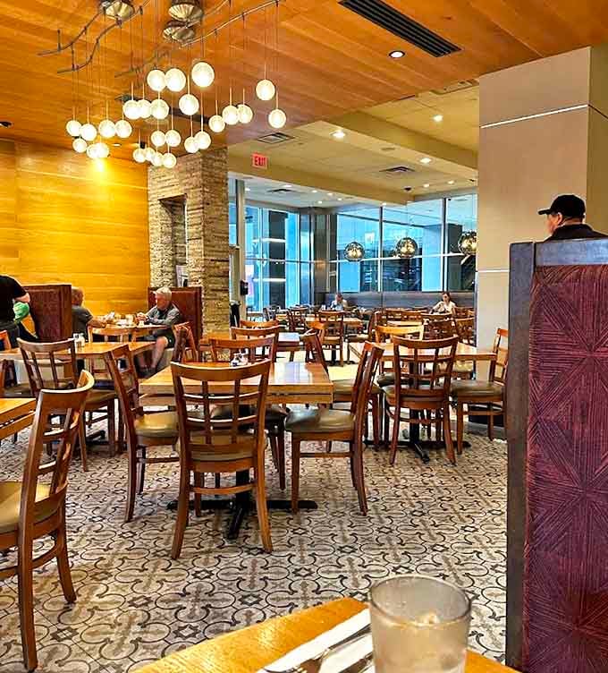 Modern pendant lighting casts a warm glow over this thoughtfully designed space where breakfast conversations flow as freely as the coffee.