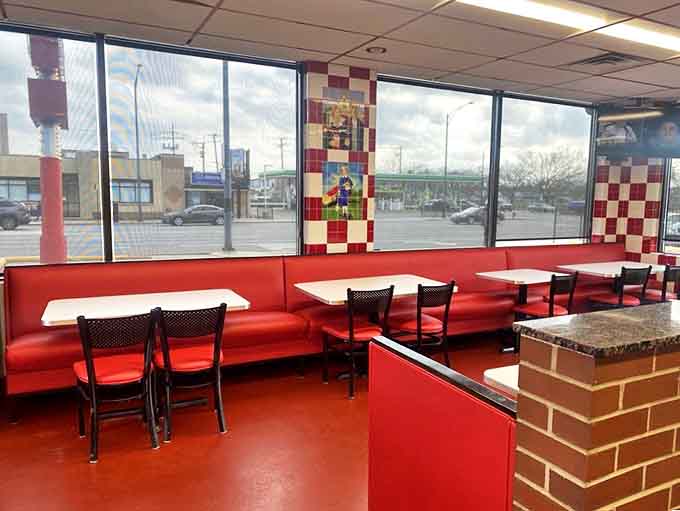 Bright windows illuminate the classic red booths where generations of Chicagoans have experienced hot dog perfection in unpretentious surroundings.