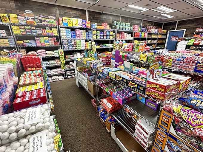 The candy aisle – where decision paralysis meets pure joy, and "I'll just get one thing" becomes a mathematical impossibility among endless sweet options.