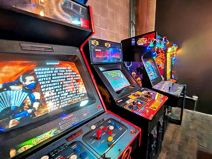 Classic arcade cabinets including Mortal Kombat stand ready to settle disputes the old-fashioned way, with digital combat and button-mashing fury.