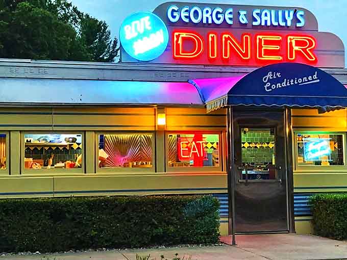 As night falls, the neon signs transform George & Sally's into a beacon of comfort food and nostalgia, glowing with promises of delicious possibilities.