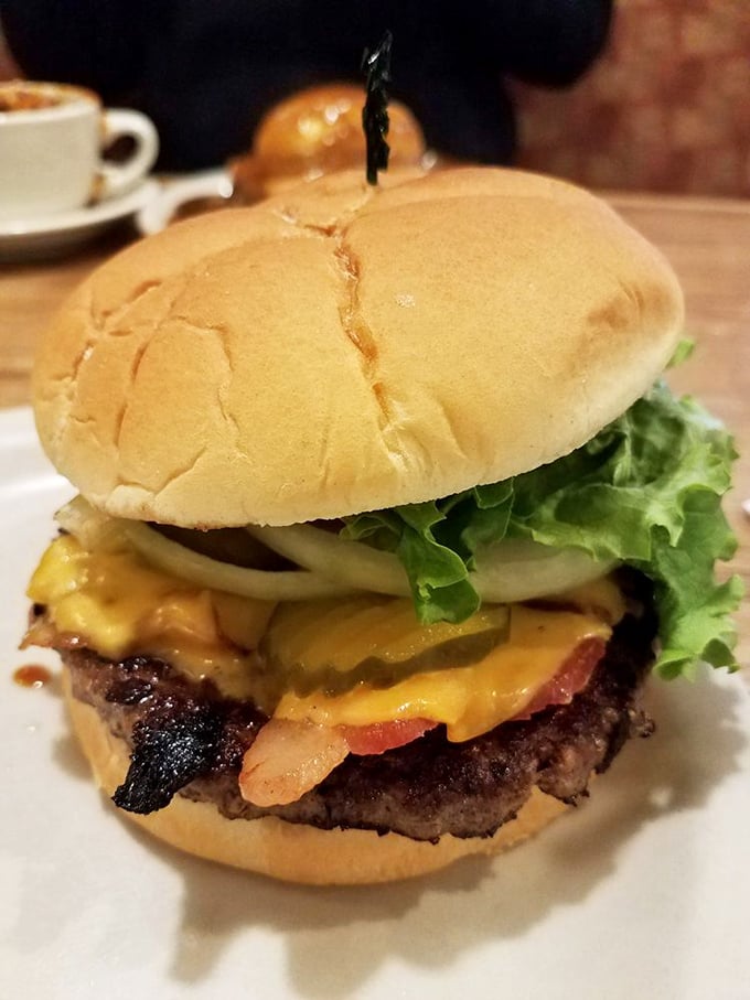 The burger that launched a thousand road trips – perfectly charred, cheese melting just so, on a bun that means business.