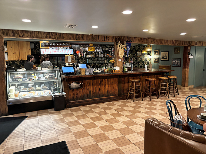 The welcoming bar area invites you to settle in with a craft cocktail while you wait for your table or simply enjoy the warm, convivial atmosphere.