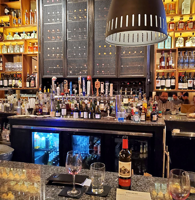 An impressive spirits selection lines the bar, where skilled mixologists craft drinks that complement the coastal cuisine perfectly.