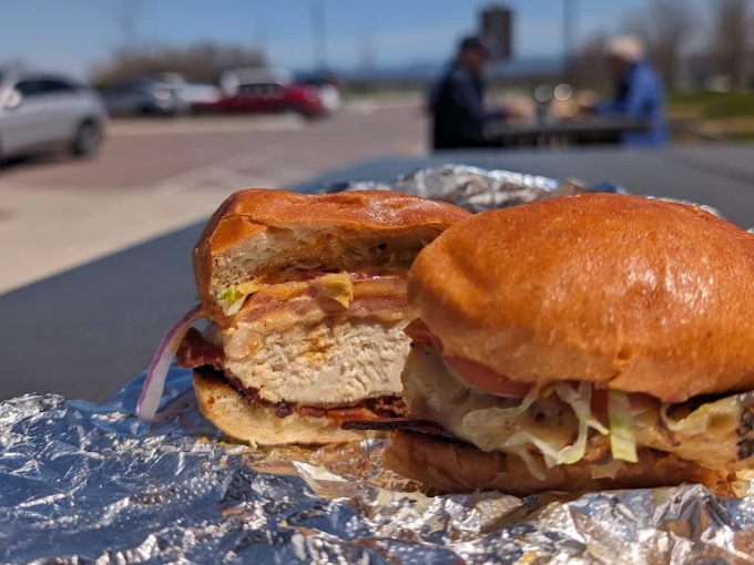 Juicy chicken nestled on fresh bread with crisp veggies, proof that poultry doesn't have to be the boring option on the menu.