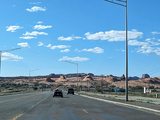 A glimpse of community along AZ 98, where modest homes stand resilient against the backdrop of nature's grand architectural showcase.