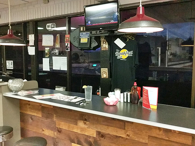 The counter where regulars perch, coffee flows freely, and breakfast magic happens behind the scenes.
