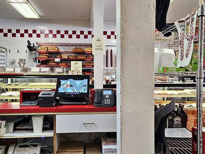 Behind the counter, the choreographed dance of slicing, assembling, and serving continues as it has for generations – efficiency born from experience.