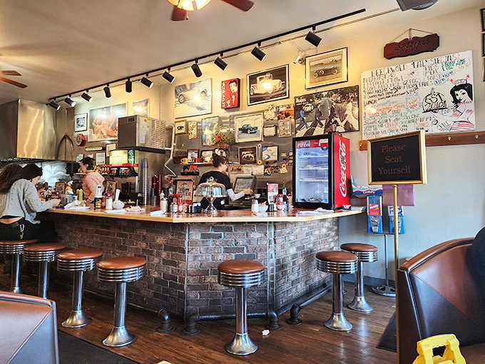 The counter view offers front-row seats to the short-order cooking show, where eggs and pancakes become performance art in the hands of experienced diner staff.