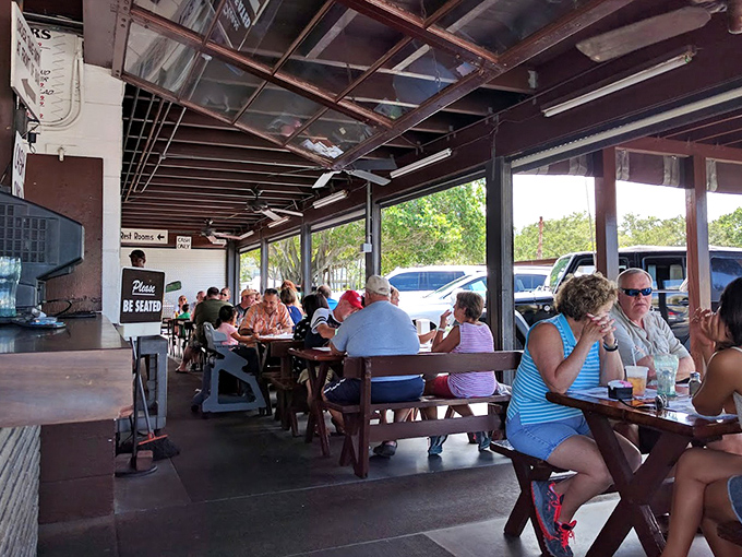 Where locals and tourists unite over smoked fish &ndash; the covered dining area buzzes with conversation and the clinking of forks.