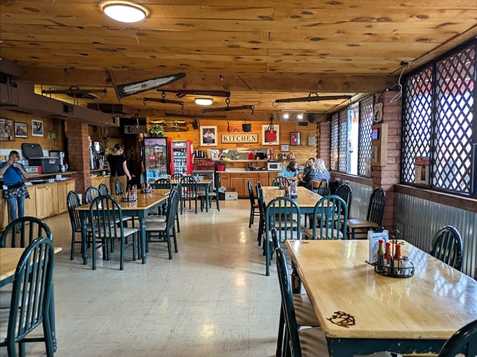 Simple wooden tables and chairs create an unpretentious dining space where the food, not the furniture, rightfully becomes the star of the show.