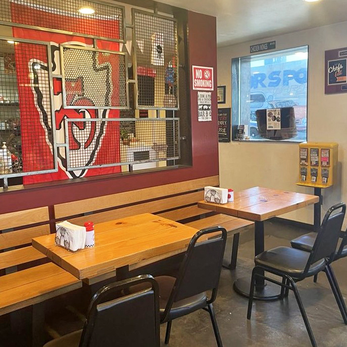 Simple wooden benches and tables invite diners to focus on what matters most: the smoky delights that await.