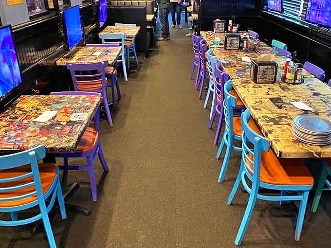 Comic book collages preserved under epoxy tabletops provide endless entertainment between bites &ndash; superhero stories to inspire your gaming heroics.