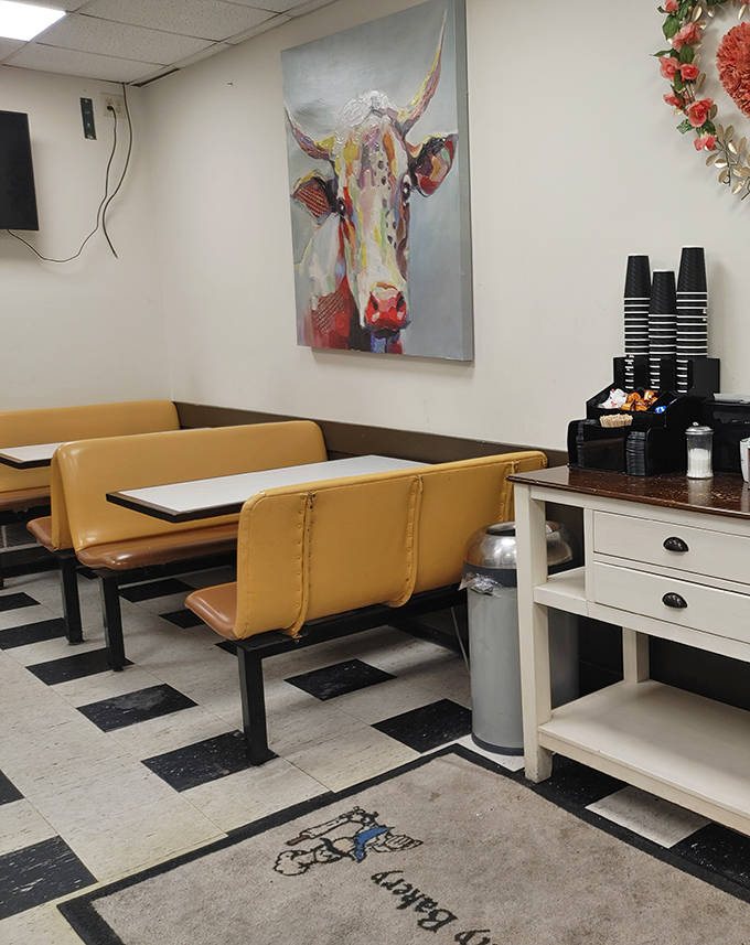 The dining area, where that magnificent cow painting seems to say, "Go ahead, order another donut. I won't tell anyone."