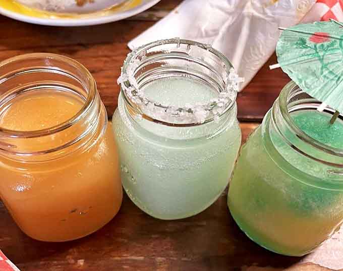 These colorful mason jar cocktails aren't just drinks&mdash;they're liquid joy, crafted to complement Watson's bold flavors while adding their own magic.