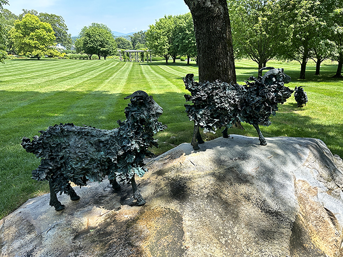 Metal goats perched on their pedestals survey the landscape like they're judging a very important agricultural competition.