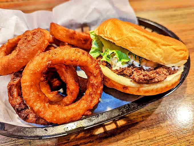 Onion rings that deserve their own fan club &ndash; light, crispy batter encasing sweet onions creates a side dish that often steals the spotlight from the main event.
