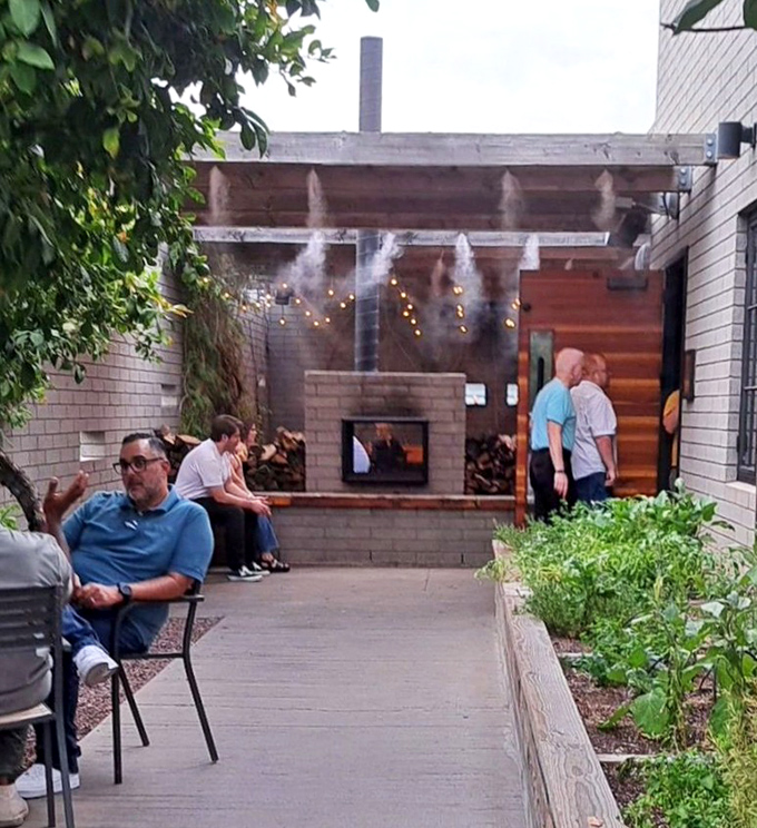 The outdoor patio offers desert-inspired tranquility, where misters combat Arizona heat and string lights create dining magic after sunset.