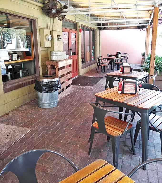 The outdoor patio offers the perfect stage for the age-old tradition of contemplating life's mysteries over a perfect biscuit sandwich.