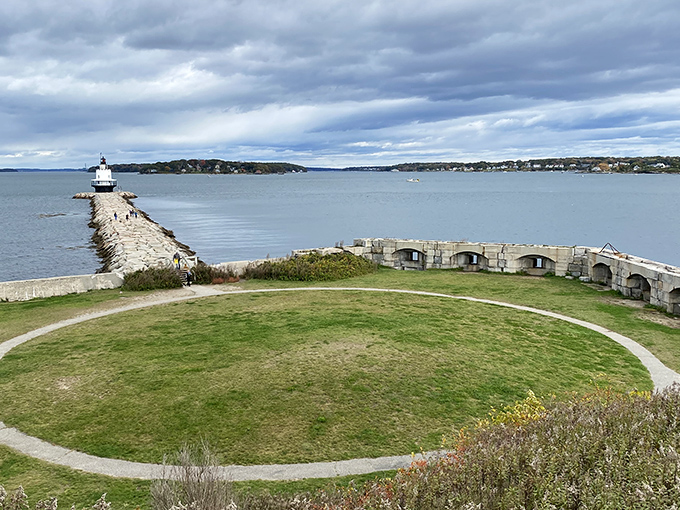 Fort Preble's parade ground offers a perfect vantage point of the breakwater and lighthouse, where military and maritime history converge.