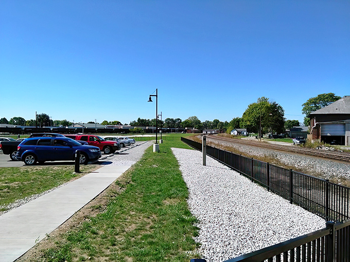 Park your car and walk along the fence to find your favorite spot for watching the frequent rail traffic.