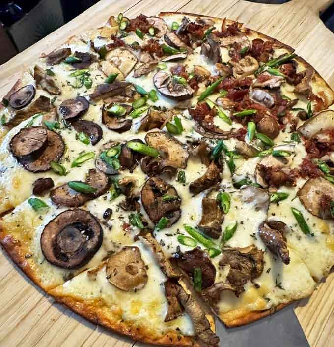 This isn't ordinary pizza – it's fuel for gaming warriors, loaded with mushrooms, green onions, and cheese worthy of Odin's feast hall.