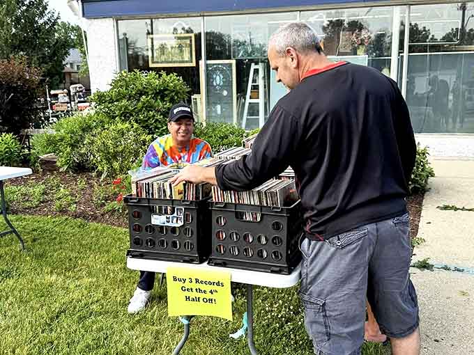 Vinyl records waiting outside like they're offering a free concert, because sometimes the best deals are the ones you stumble upon.