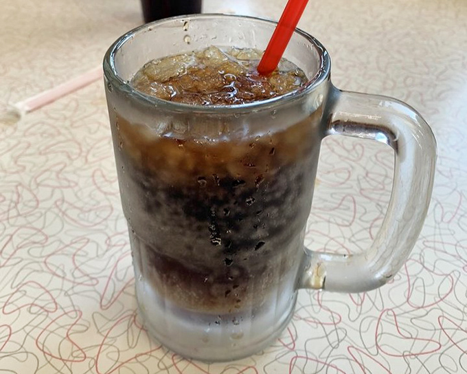 The house-made root beer arrives in a frosty mug, promising carbonated bliss that no mass-produced soda could ever deliver.