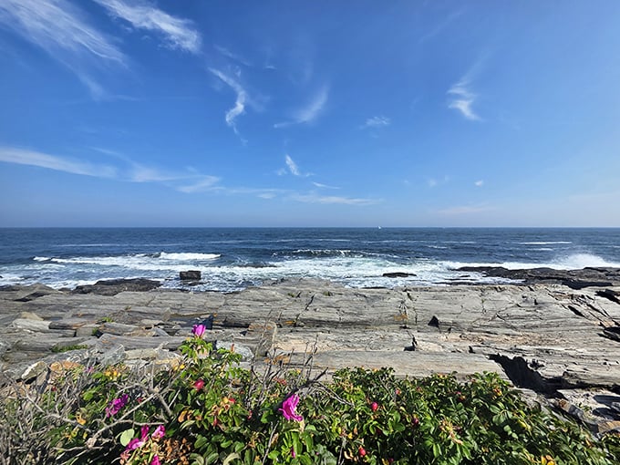 Waves crash against ancient rocks just steps from your table, nature's entertainment during your seafood feast.