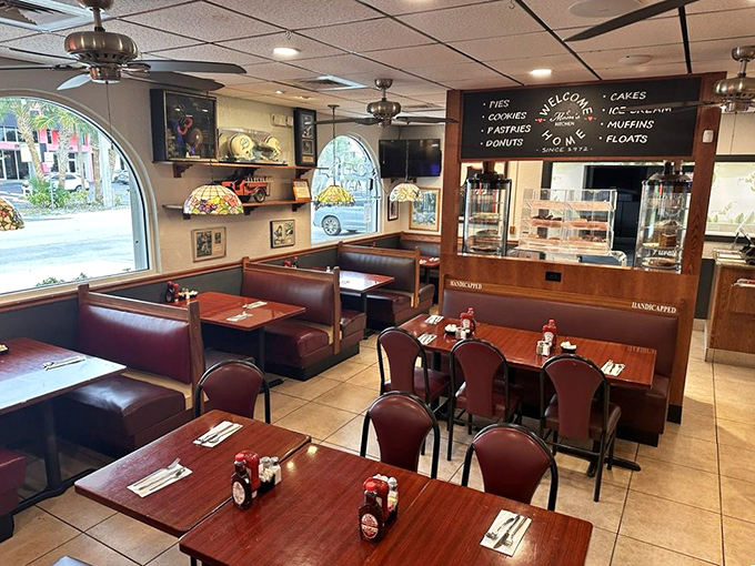 The dining room sits quietly in the morning light, tables set and ready for the familiar comfort of a classic diner breakfast.