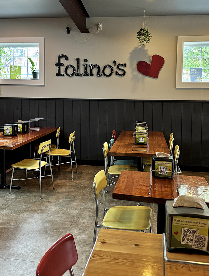 Simple wall art says it all &ndash; Folino's heart belongs to pizza, and after one bite, yours will too.