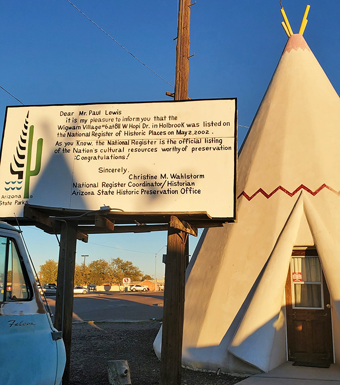 A proud sign announces the motel's well-deserved place on the National Register of Historic Places, preserving this slice of Americana.